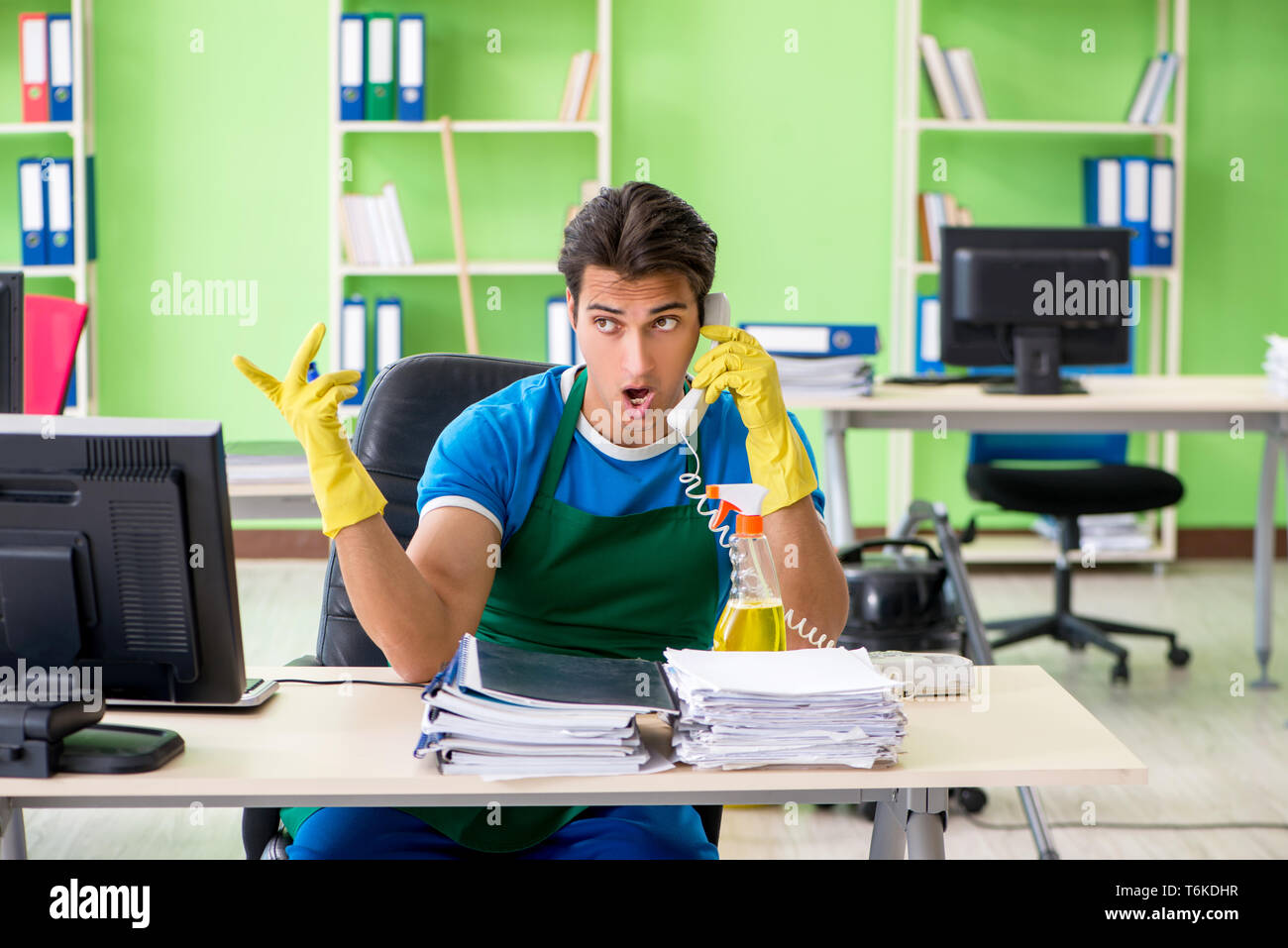 Male spy under cleaner cover stealing confidential documents Stock ...