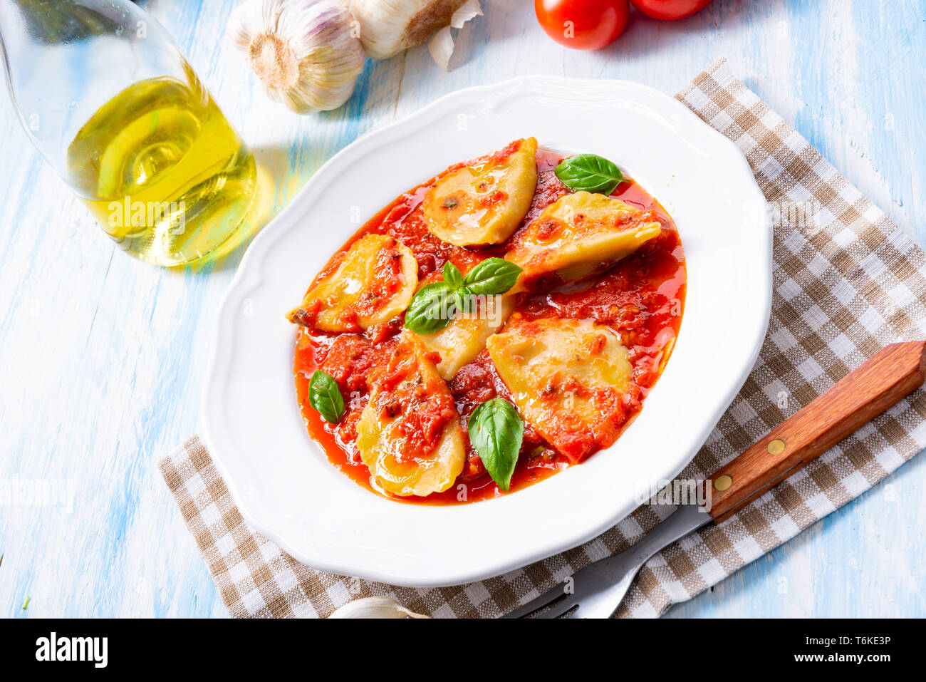 Delicious pasta - ravioli in tomato sauce with basil Stock Photo - Alamy