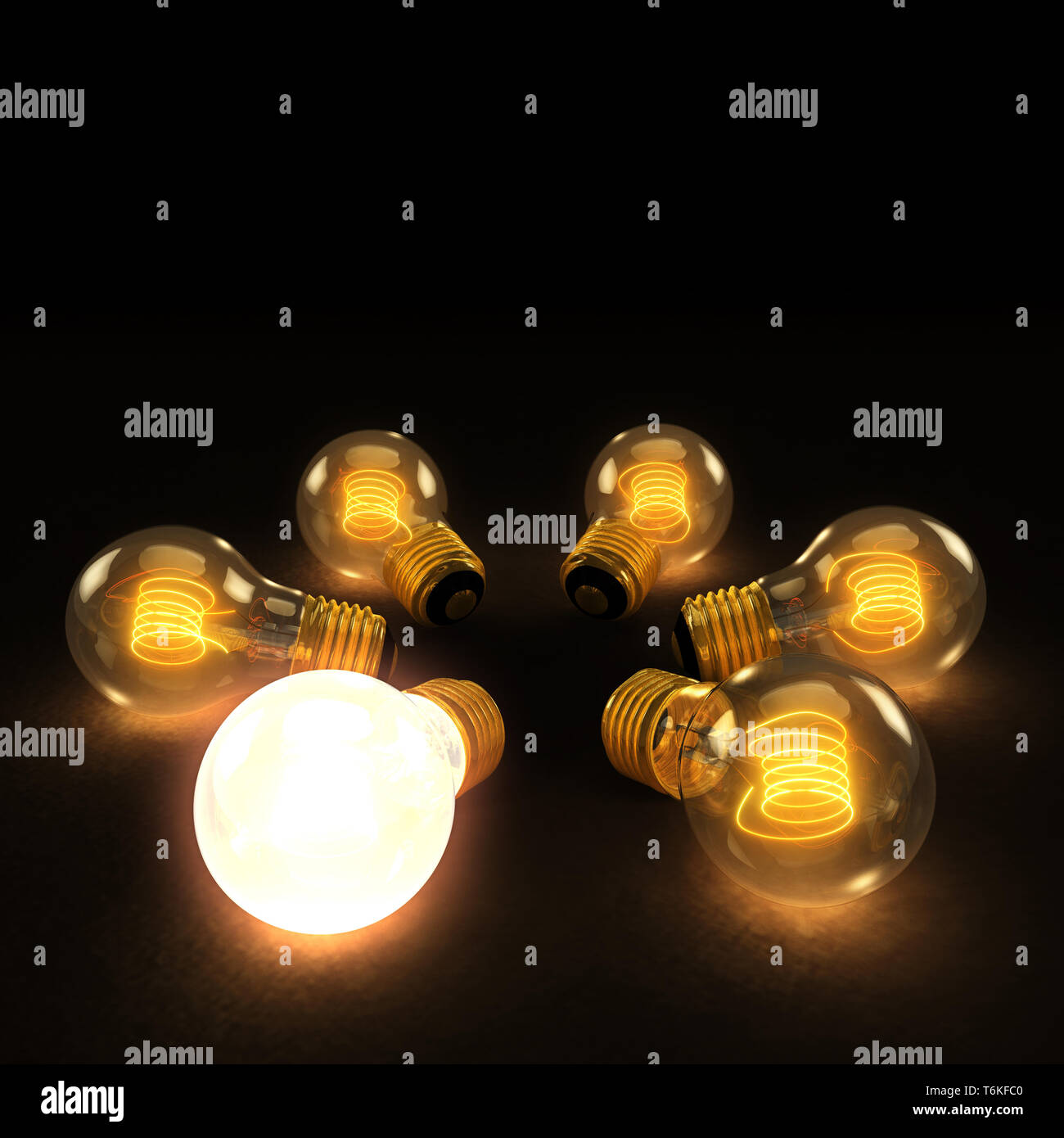 Six illuminated incandescent light bulbs in a circle on a dark ...