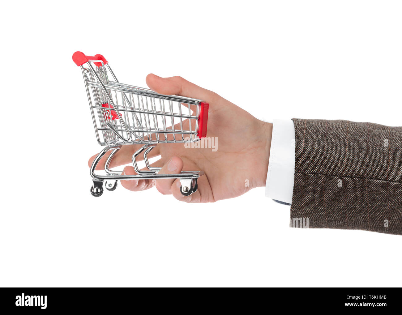 Hand with shopping cart Stock Photo - Alamy