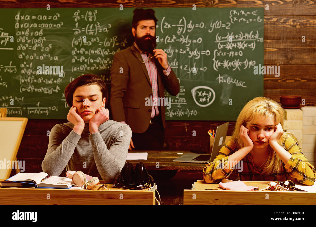 Happy university students studying with books in library. Great ...