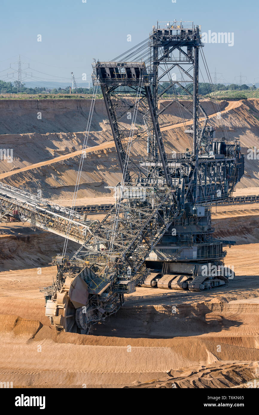 Brown coal open pit landscape with digging excavator in Germany Stock ...