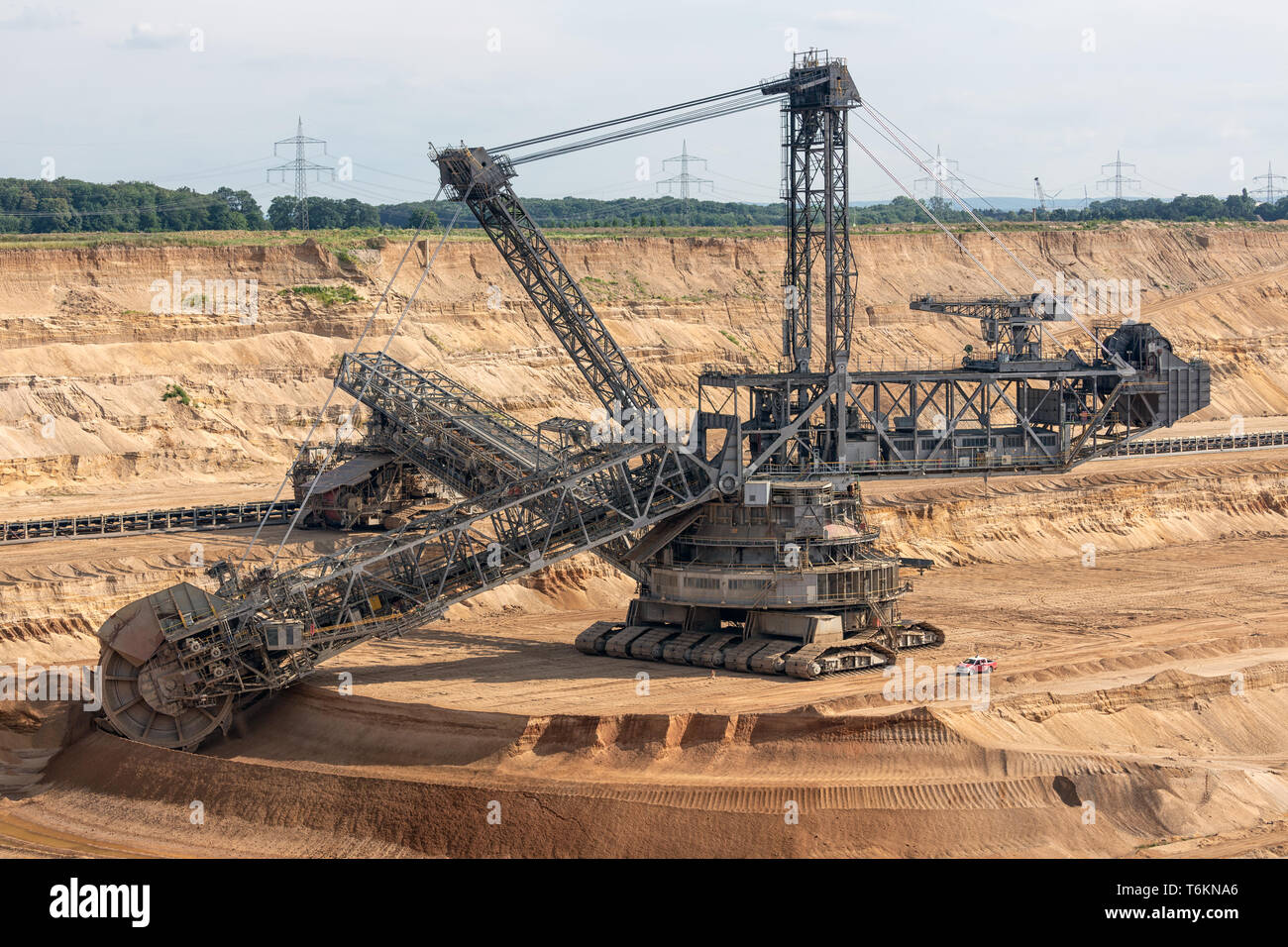 Brown coal open pit landscape with digging excavator in Germany Stock ...
