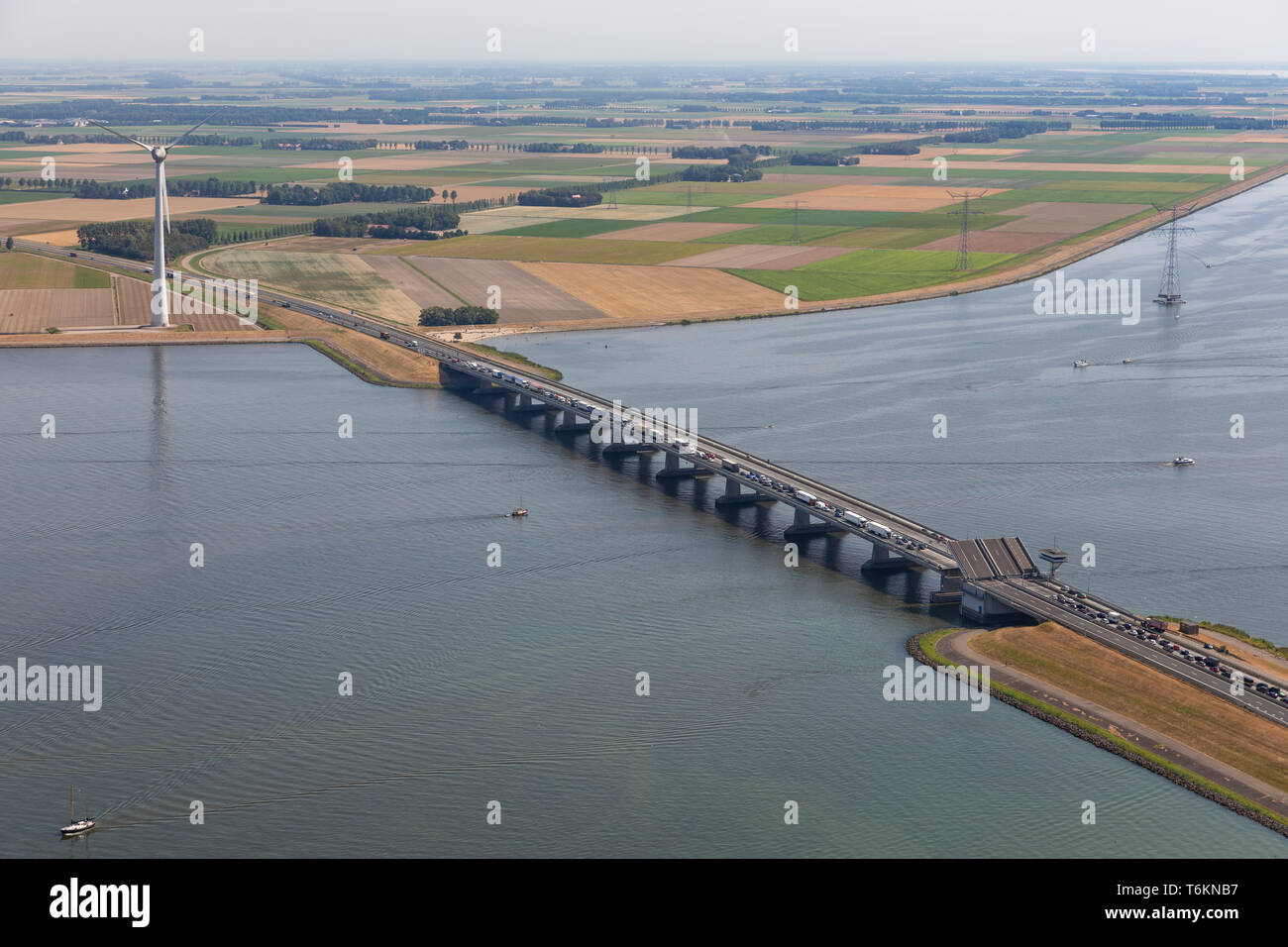 Aerial view Dutch landscape with bridge and wind turbines Stock Photo ...