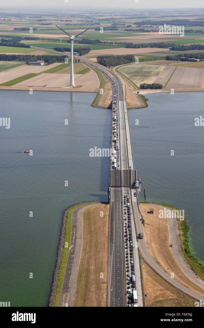 Aerial view Dutch landscape with bridge and wind turbines Stock Photo ...