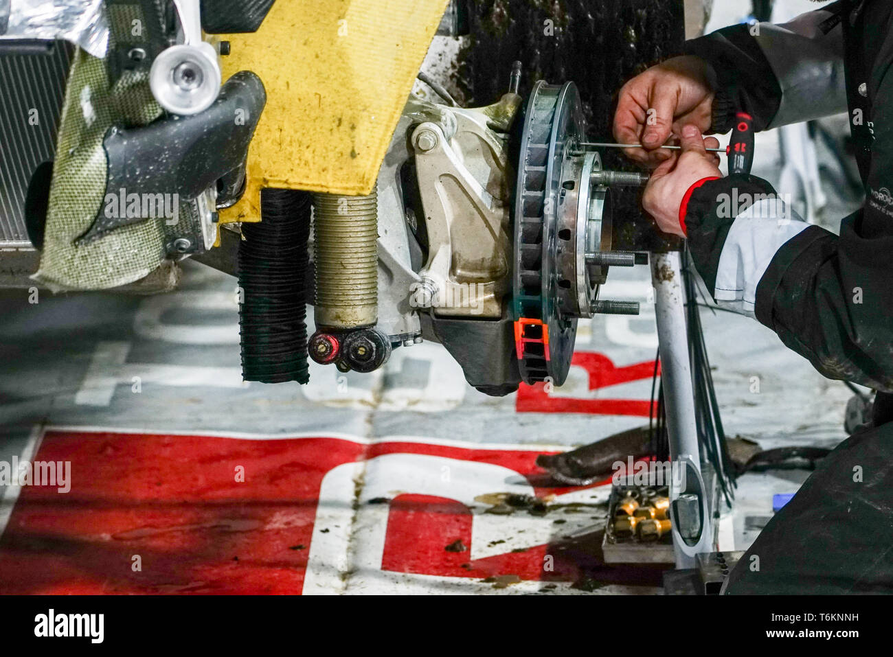 brake system repair to the rally car before leaving to the race, WRC ...