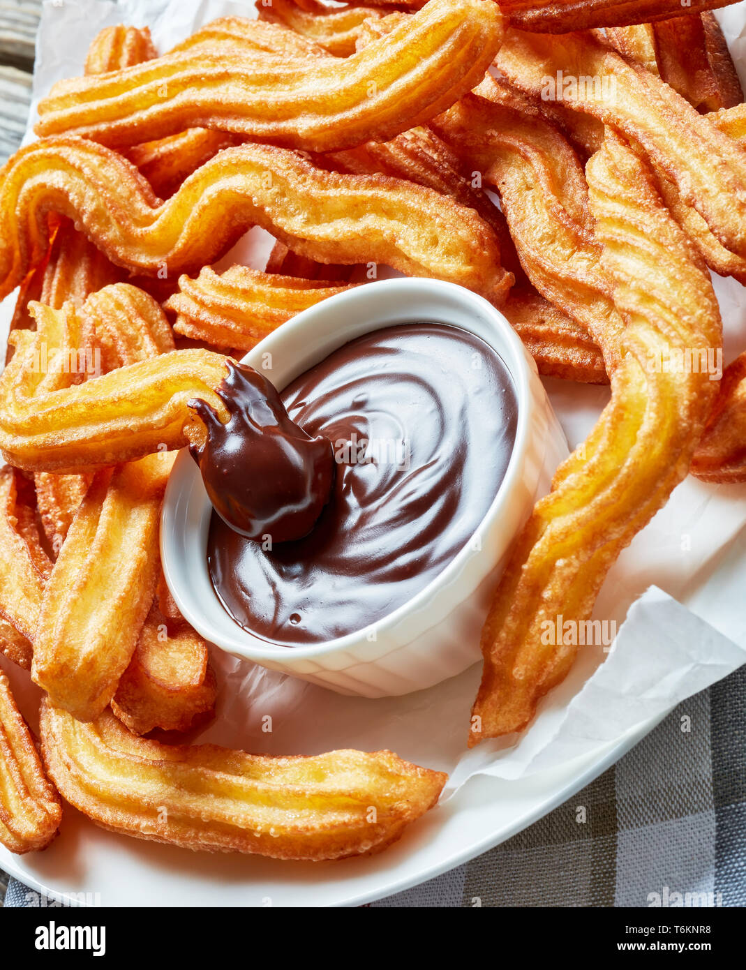 delicious deep fried churros served with chocolate dipping on a white ...