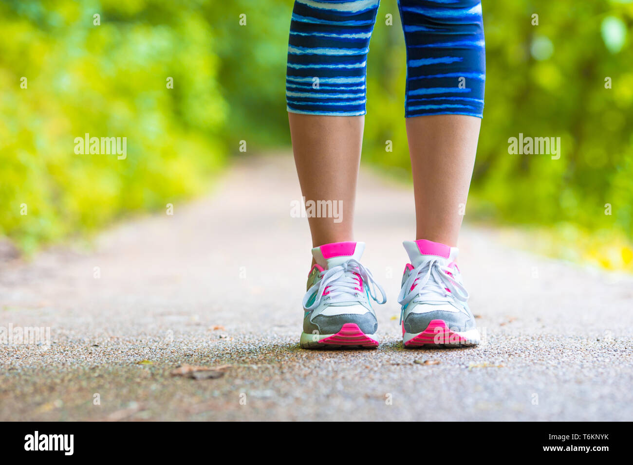 Close-up on shoe of athlete runner woman feet running on road Stock ...