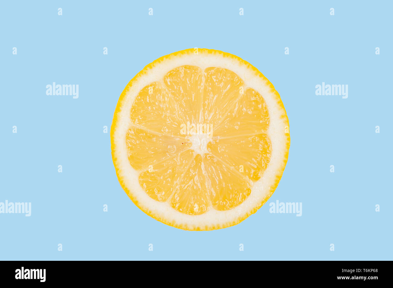 Fresh lemon slice on pastel blue background Stock Photo - Alamy