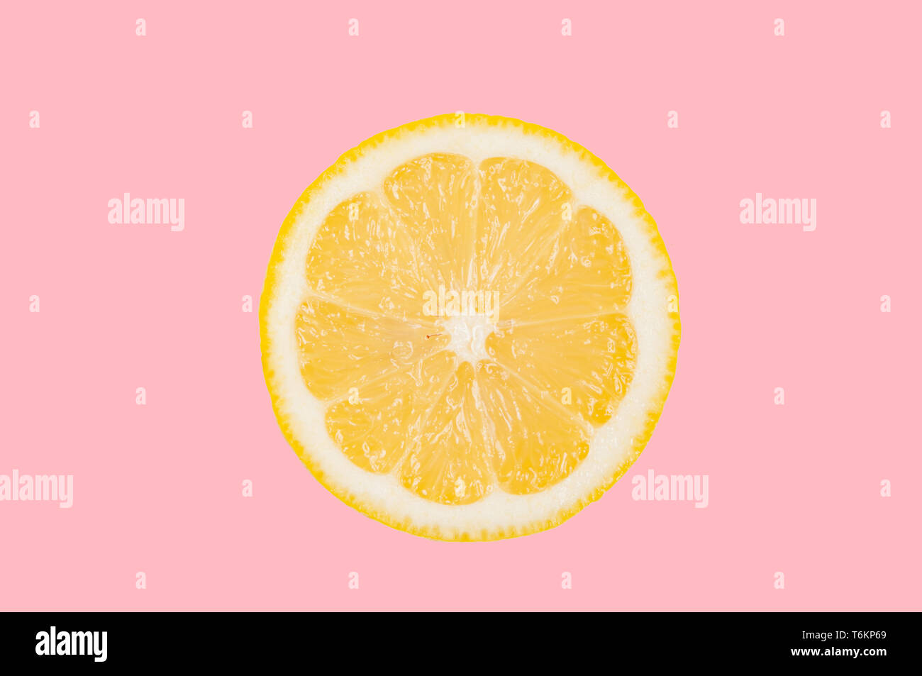Fresh lemon slice on pastel pink background Stock Photo - Alamy