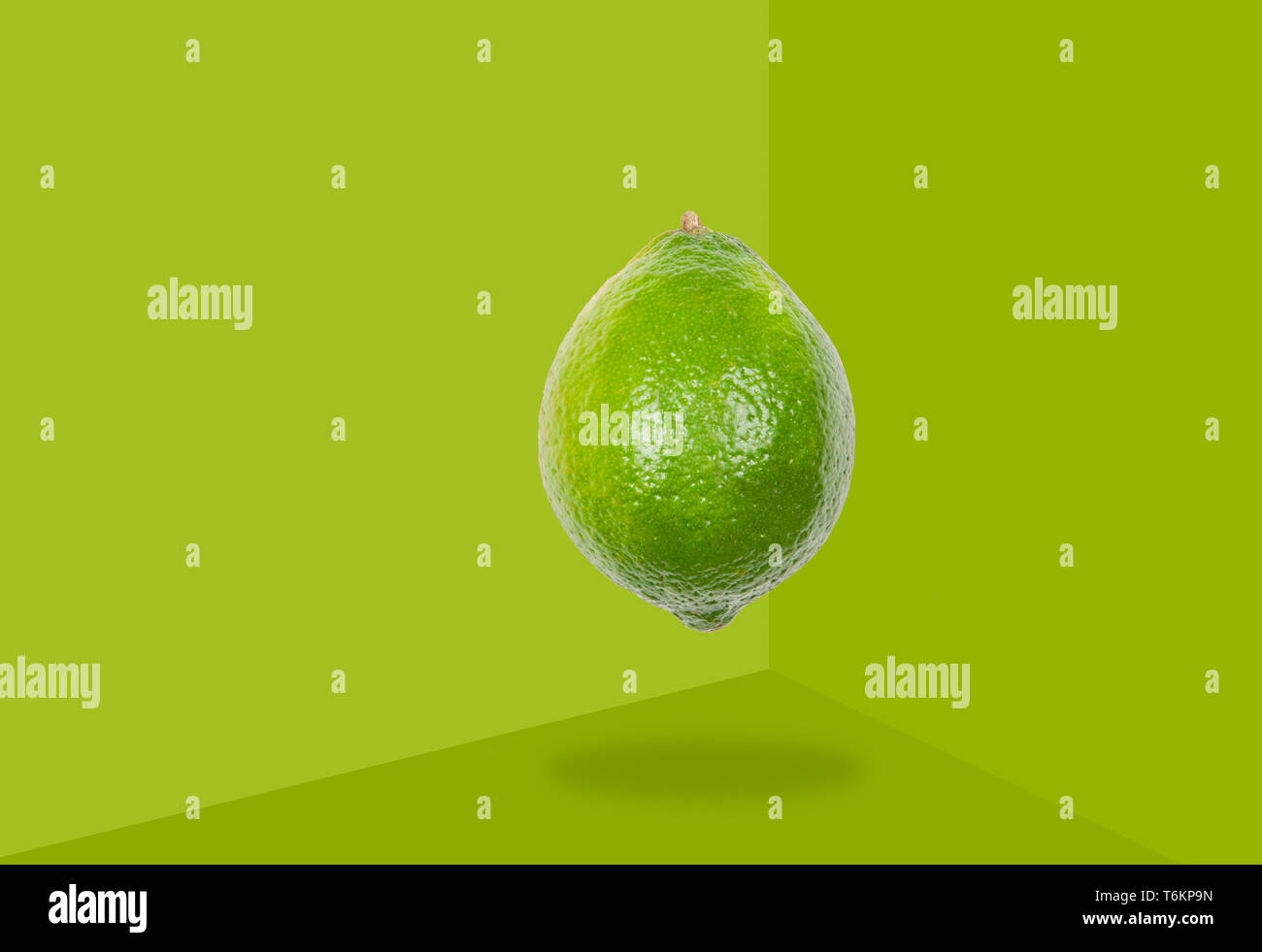 Fresh lime levitate in air on green background. Concept of fruit ...