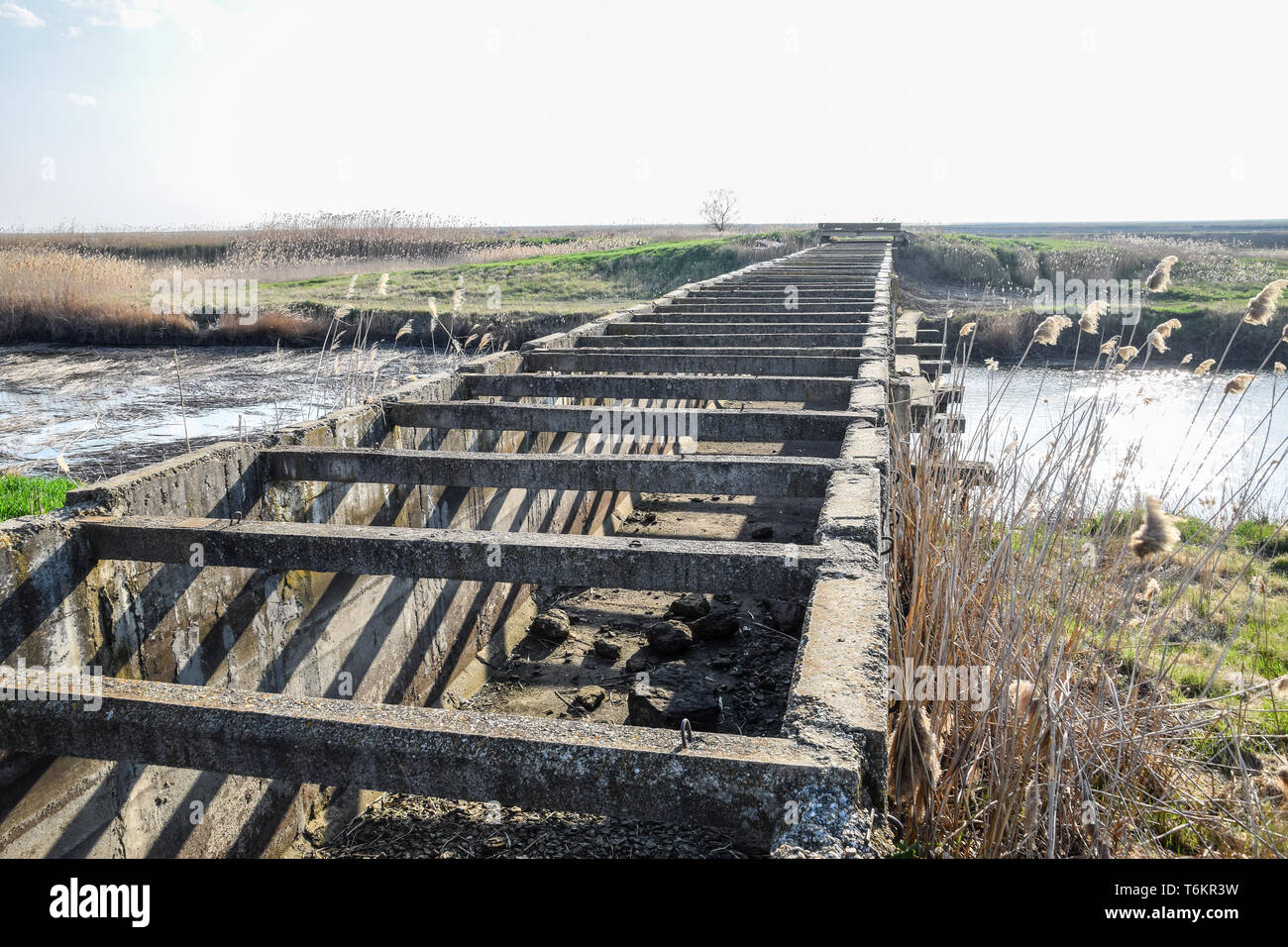 Canal irrigation system rice fields. Concrete tunnel for the irrigation ...