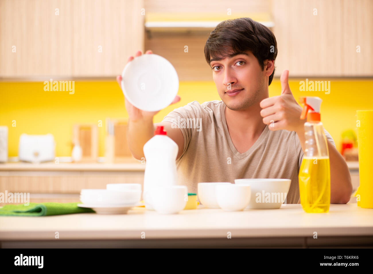 Man washing dishes at home Stock Photo - Alamy