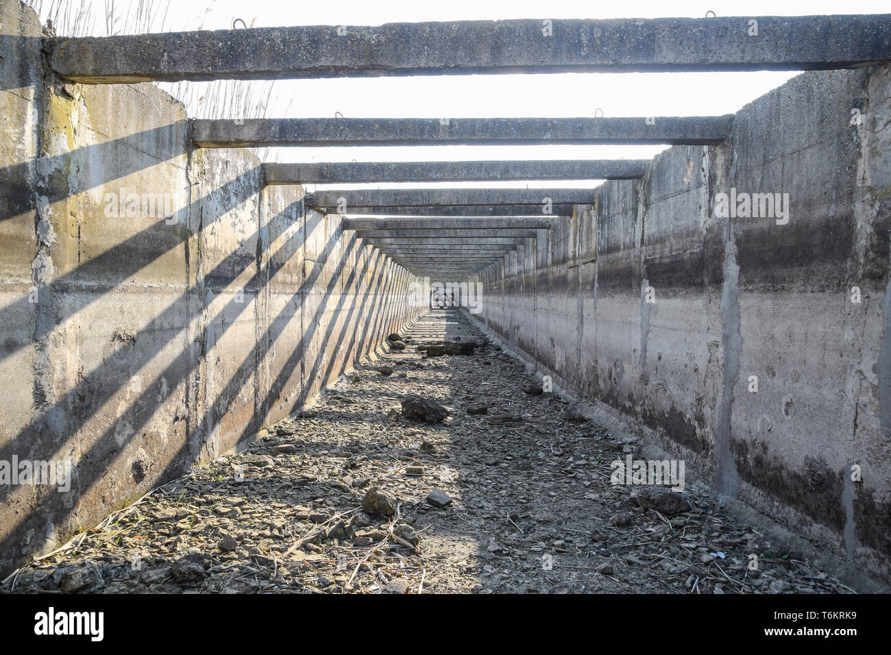 Canal irrigation system rice fields. Concrete tunnel for the irrigation ...