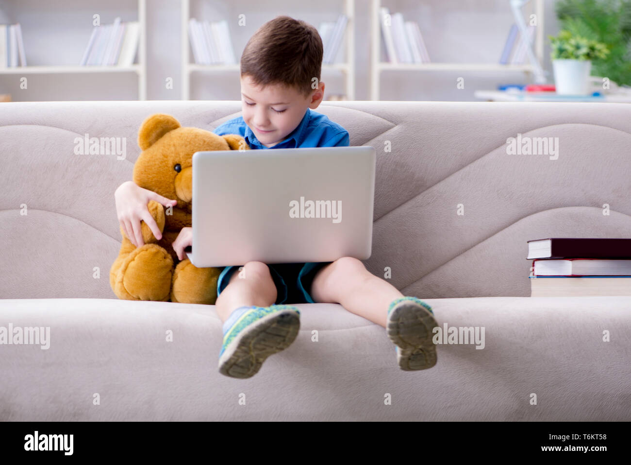 Little boy surfing internet on laptop Stock Photo - Alamy