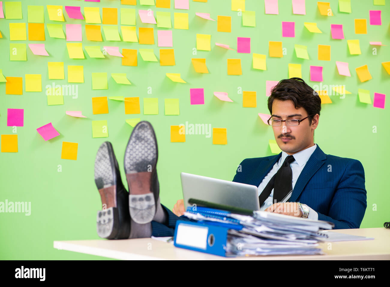 Businessman having trouble with his priorities Stock Photo - Alamy