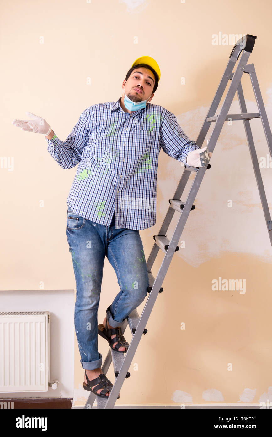 Young contractor sanding wall hi-res stock photography and images - Alamy