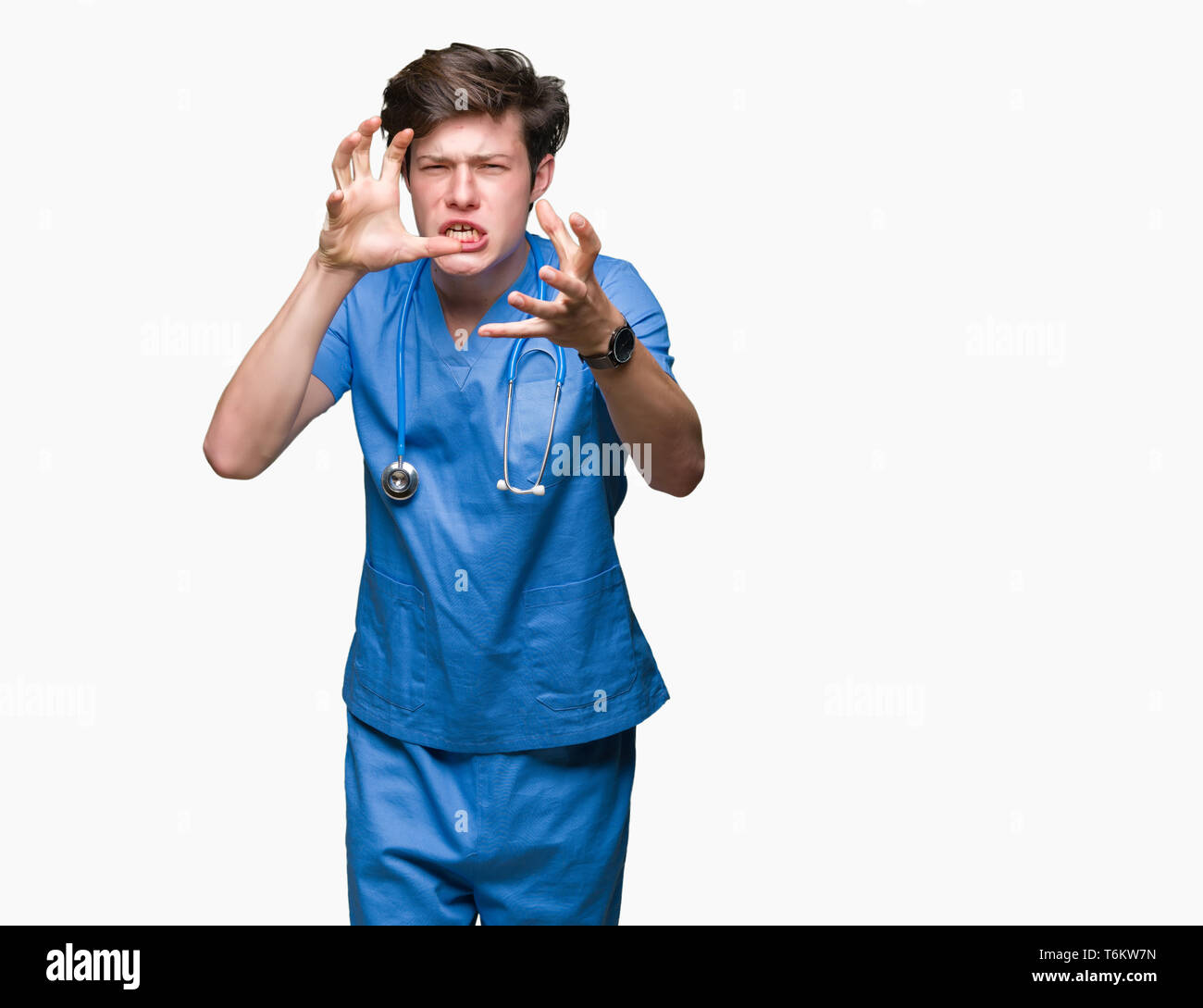 Young doctor wearing medical uniform over isolated background Shouting ...