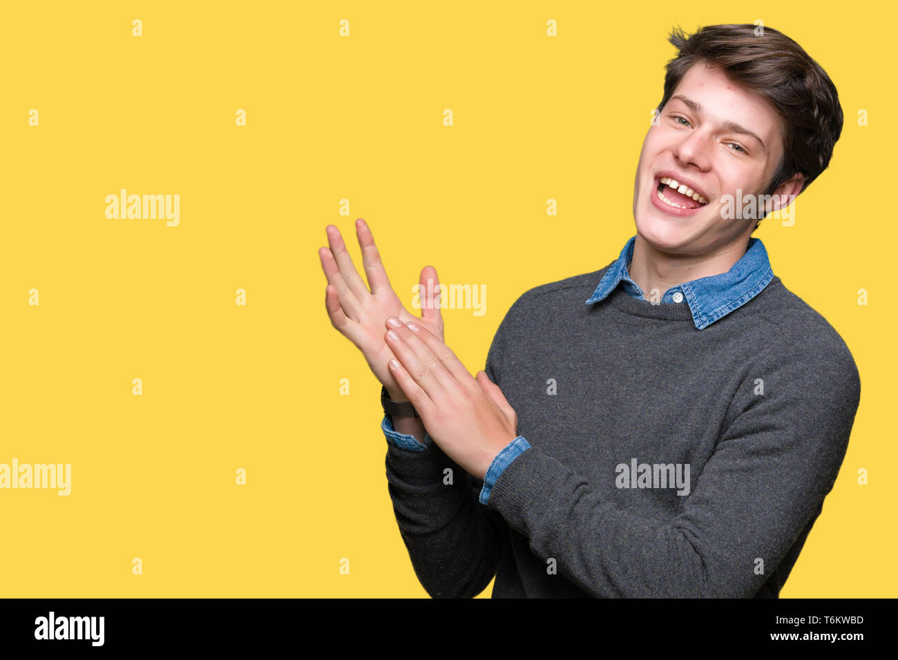 Young handsome elegant man over isolated background Clapping and ...