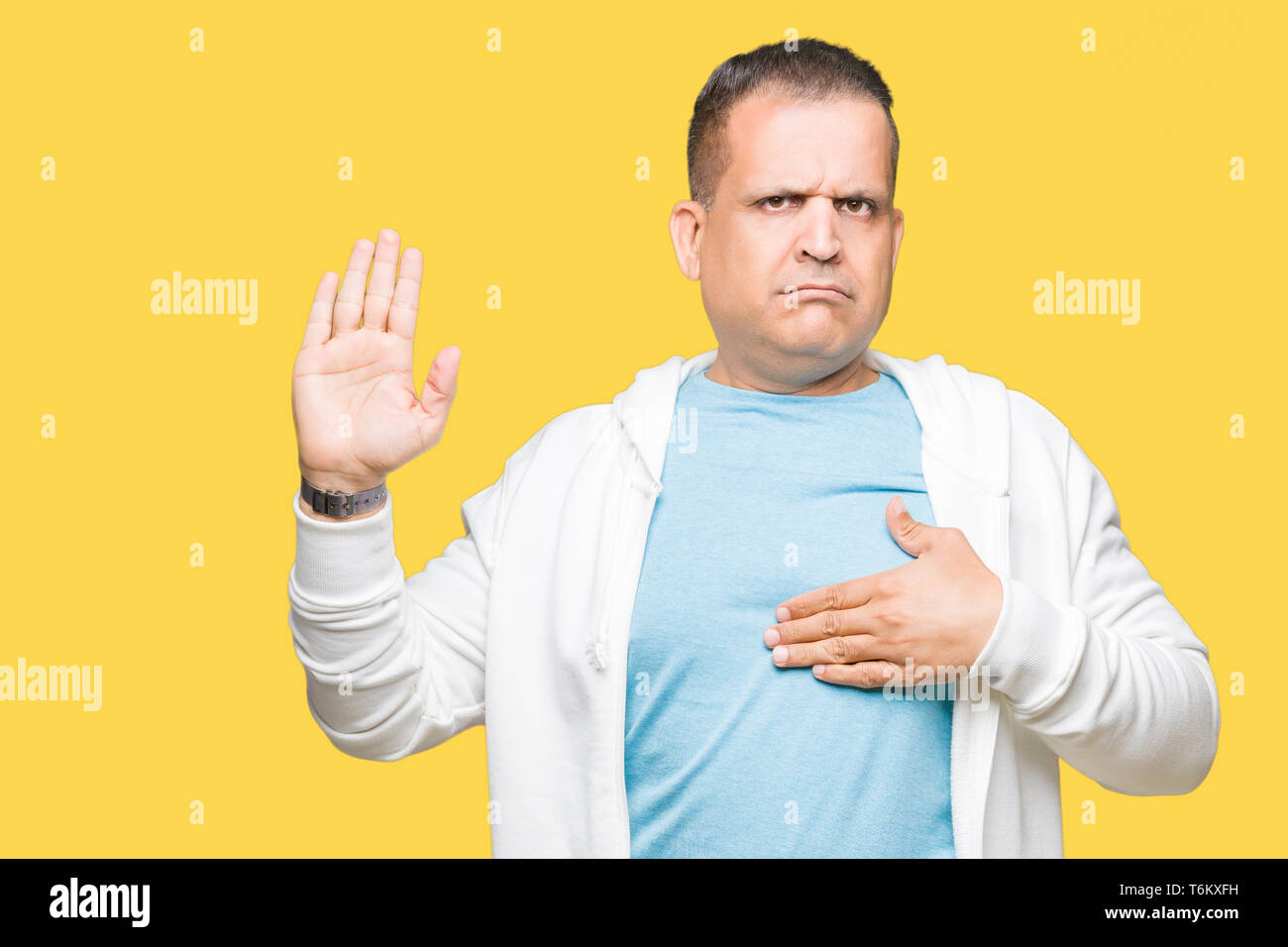 Middle age arab man wearing sweatshirt over isolated background ...