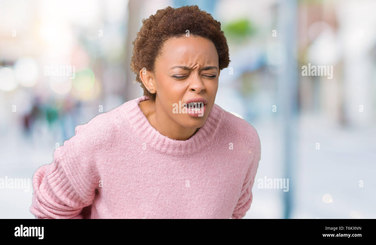 Beautiful young african american woman over isolated background with ...