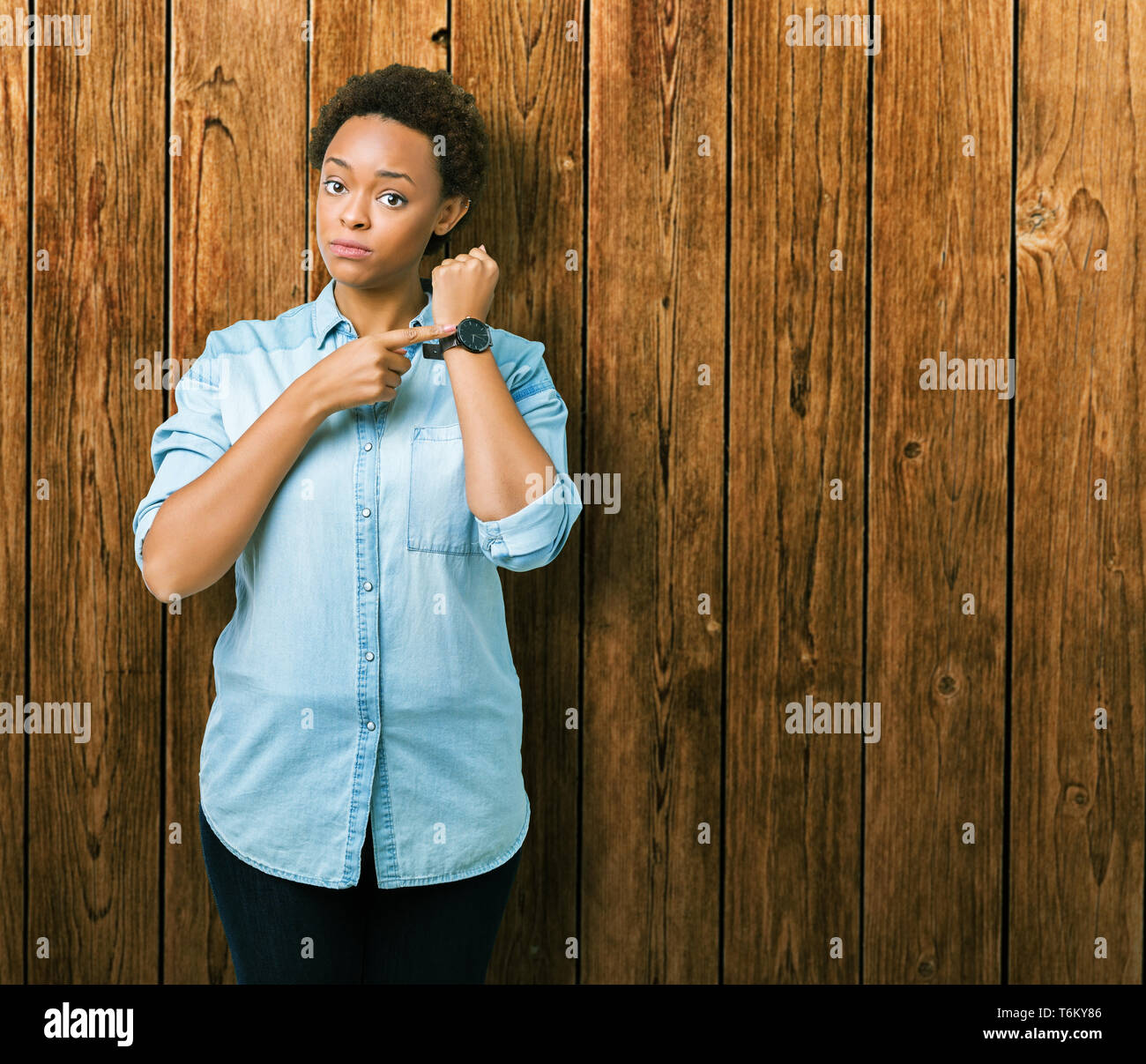 Young beautiful african american woman over isolated background In ...