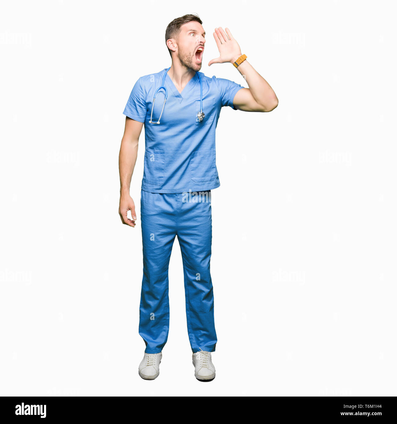 Handsome doctor man wearing medical uniform over isolated background ...