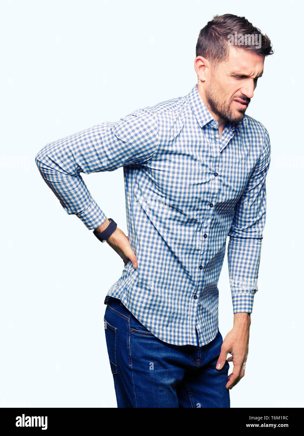 Handsome business man with blue eyes Suffering of backache, touching ...