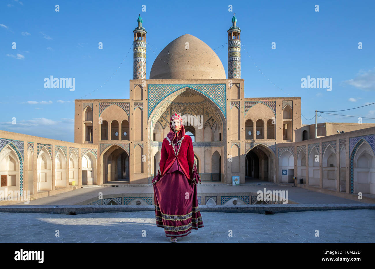 young beautiful iranian lady dressed in red traditional dress in a ...