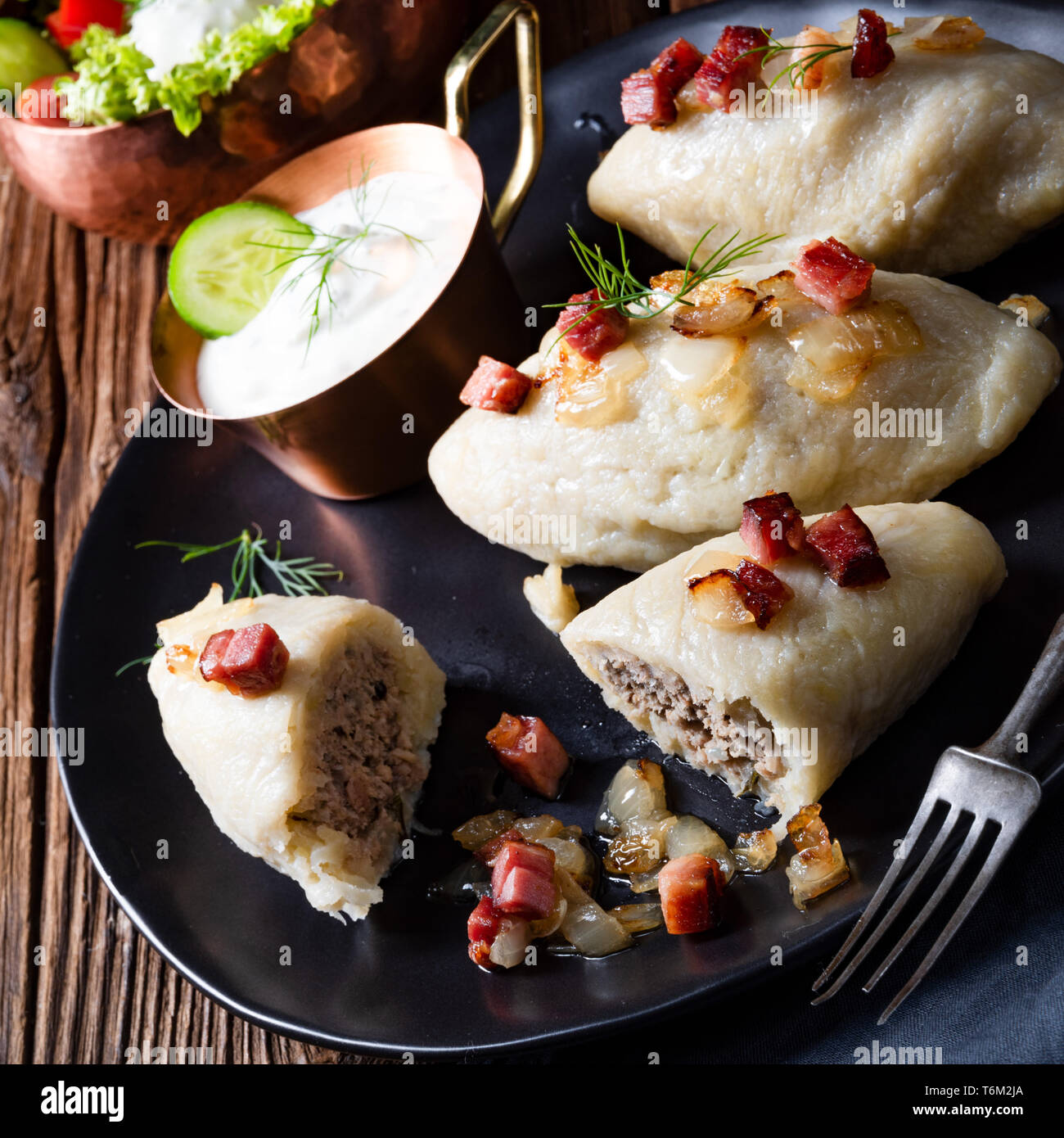 Rustic Cepelinai, a specialty Lithuanian and Polish cuisine Stock Photo ...