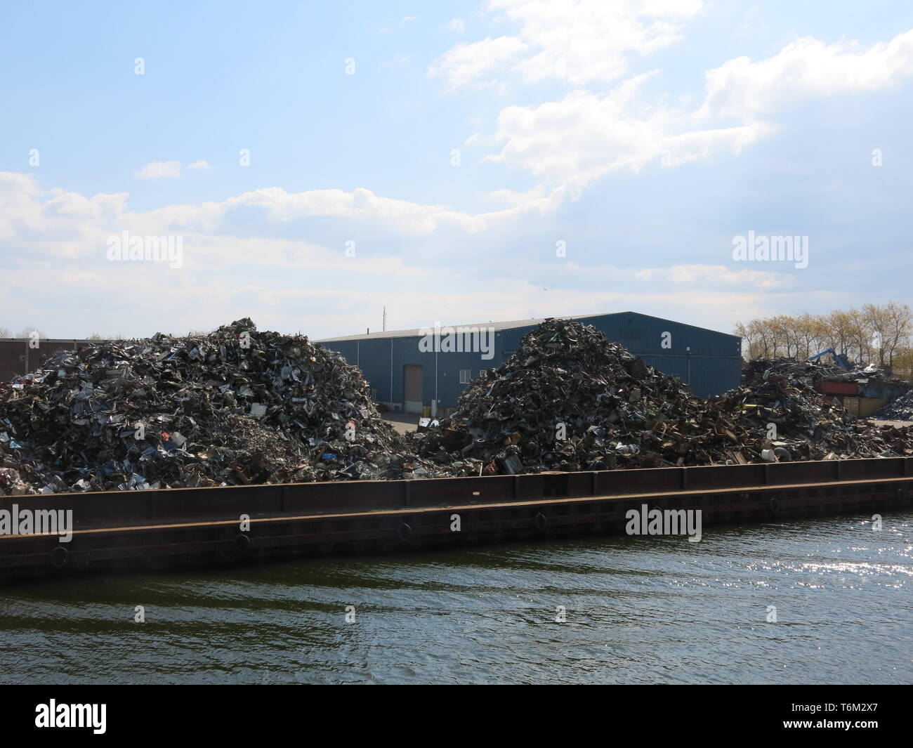 Mounds of waste for recycling on the canal-side site of Herstaco.com in ...