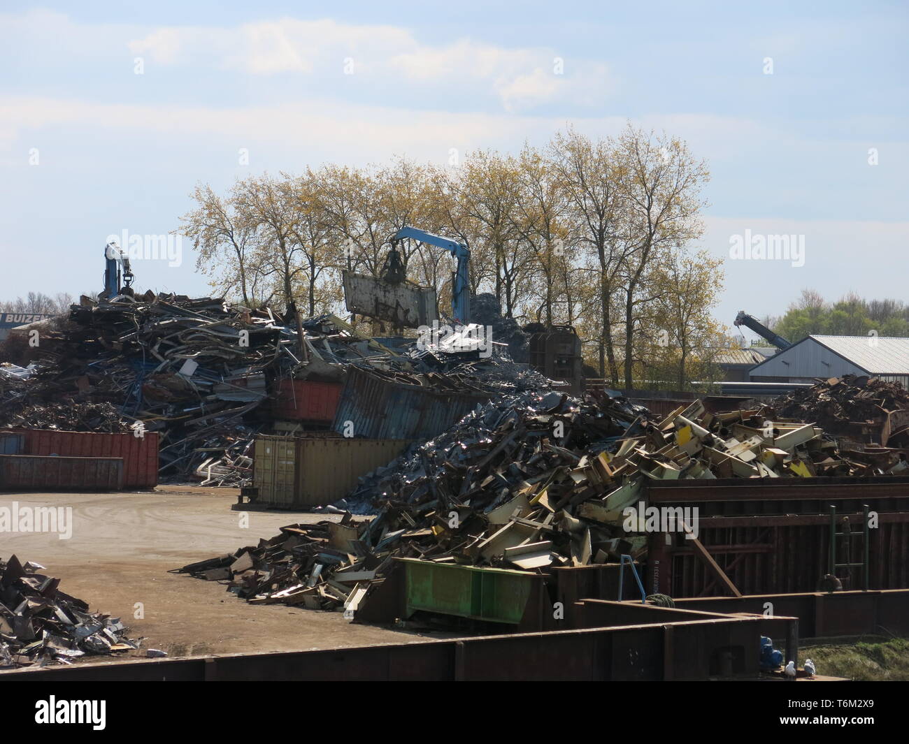 Mounds of waste for recycling on the canal-side site of Herstaco.com in ...
