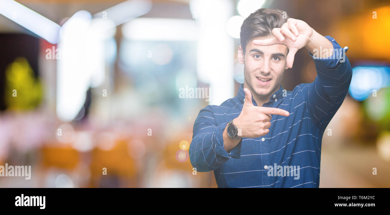 Young handsome man wearing navy shirt over isolated background smiling ...