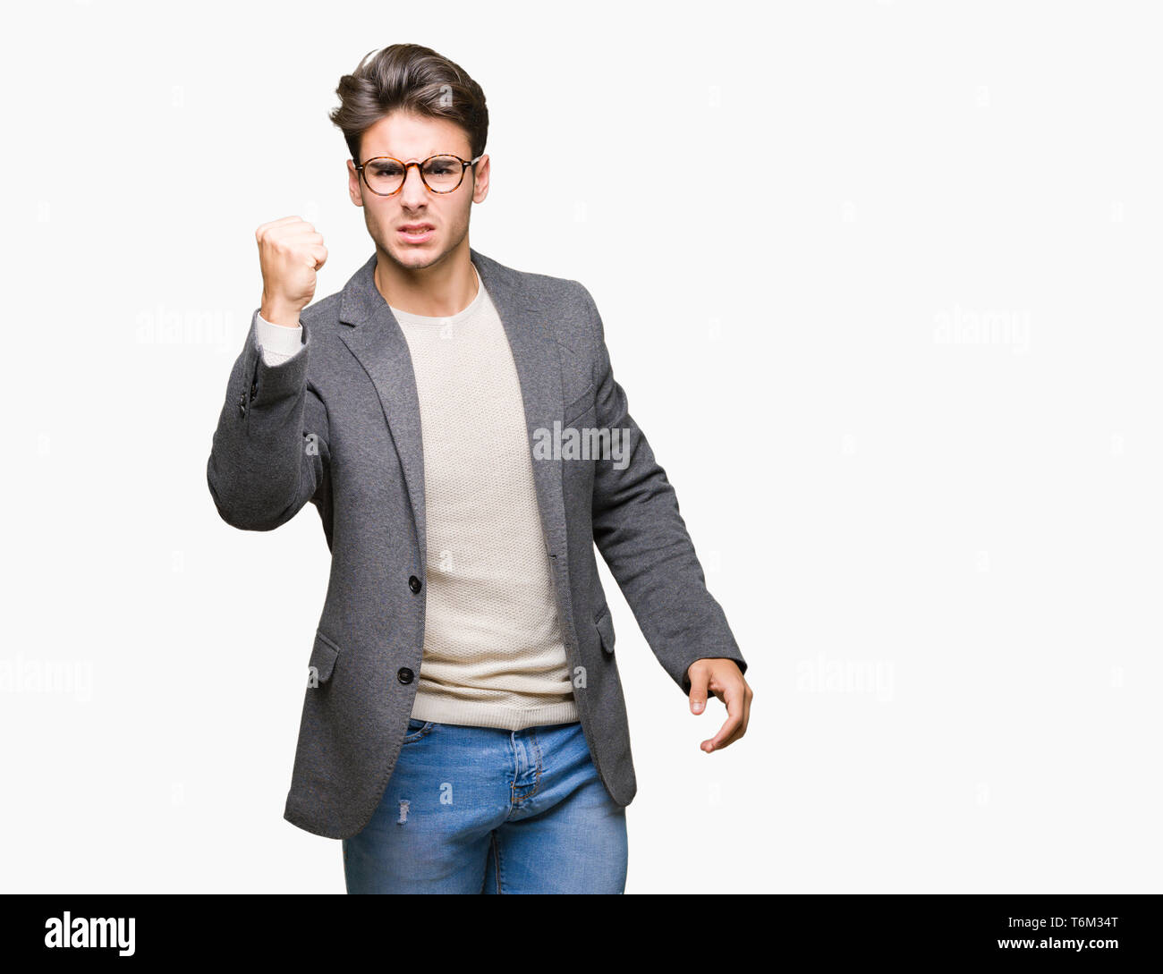 Young business man wearing glasses over isolated background angry and ...