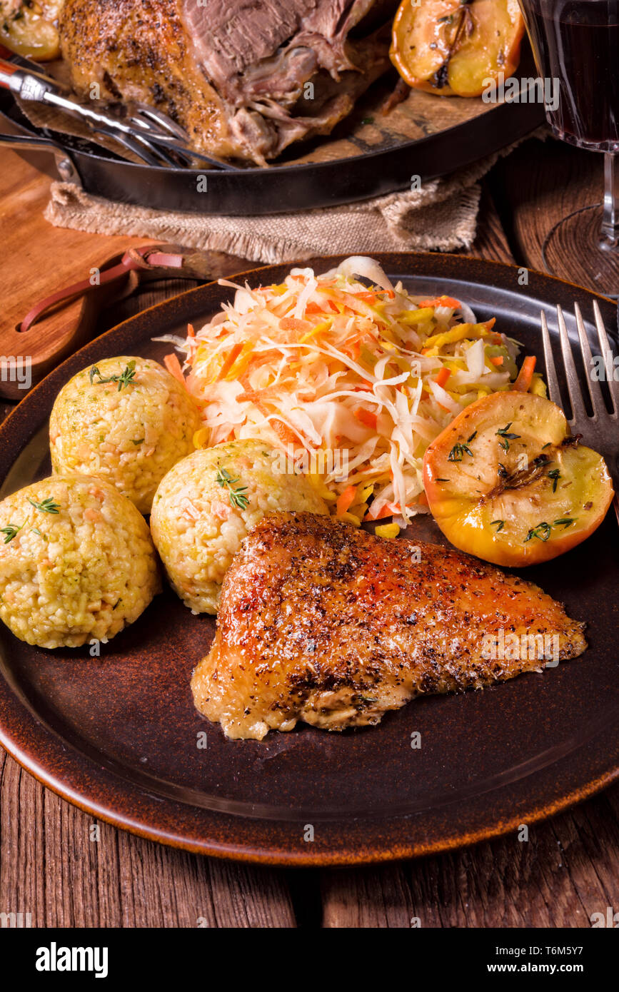 classic and crispy roasted duck with cabbage and dumplings Stock Photo ...