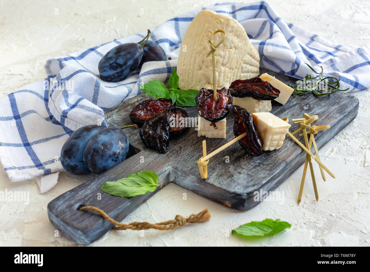 Dried plum with spices and homemade cheese Stock Photo - Alamy