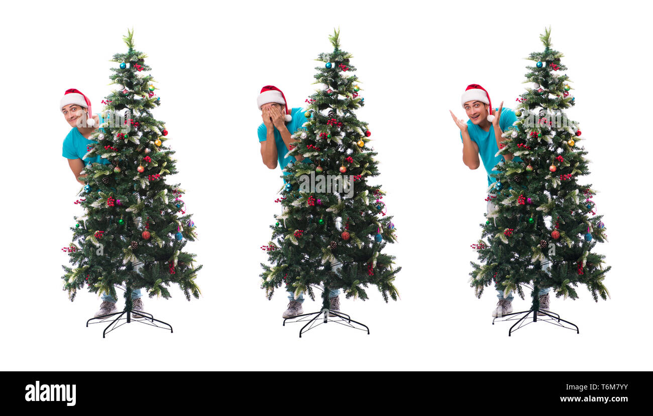 Young man decorating christmas tree isolated on white Stock Photo - Alamy