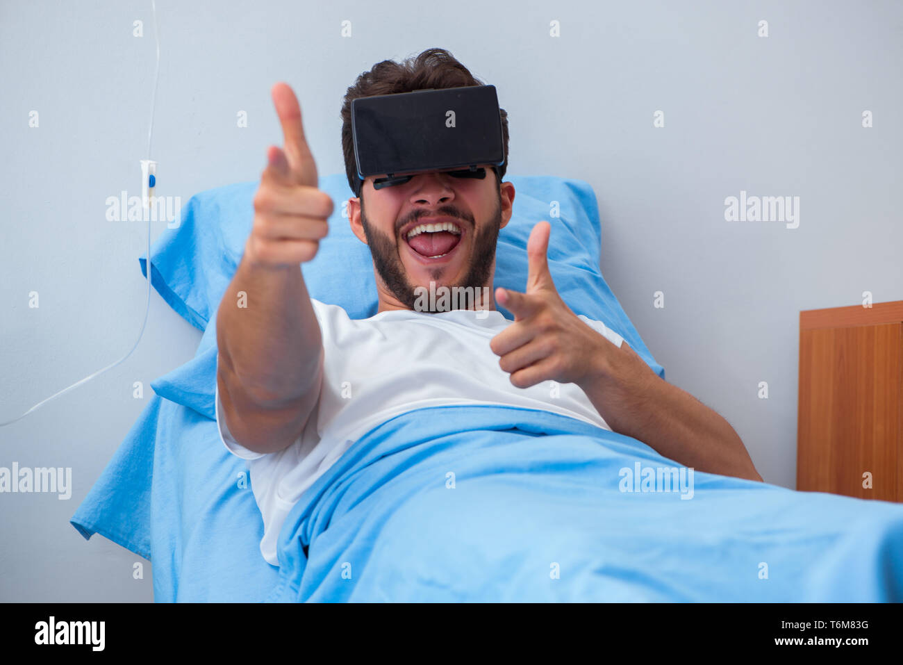 Patient in the hospital with VR glasses headset Stock Photo - Alamy
