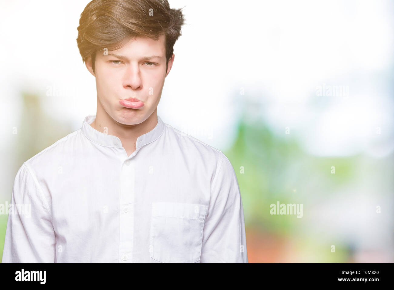 Young handsome business man over isolated background depressed and ...