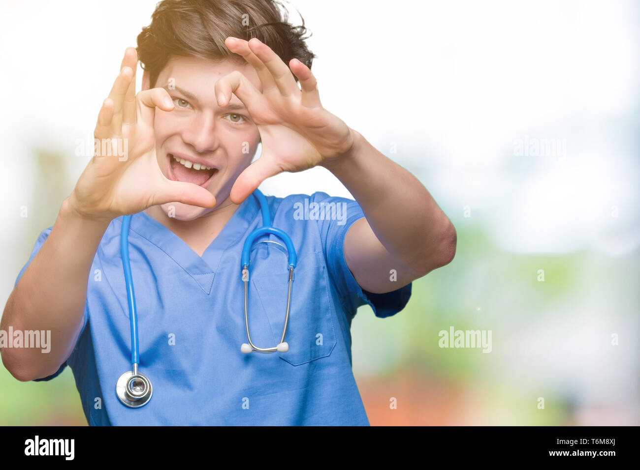 Young doctor wearing medical uniform over isolated background smiling ...