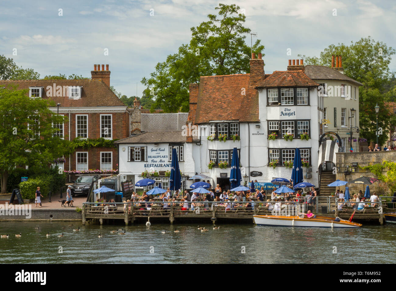 A classic slipper launch moored outside the Angel on the Bridge pub at ...