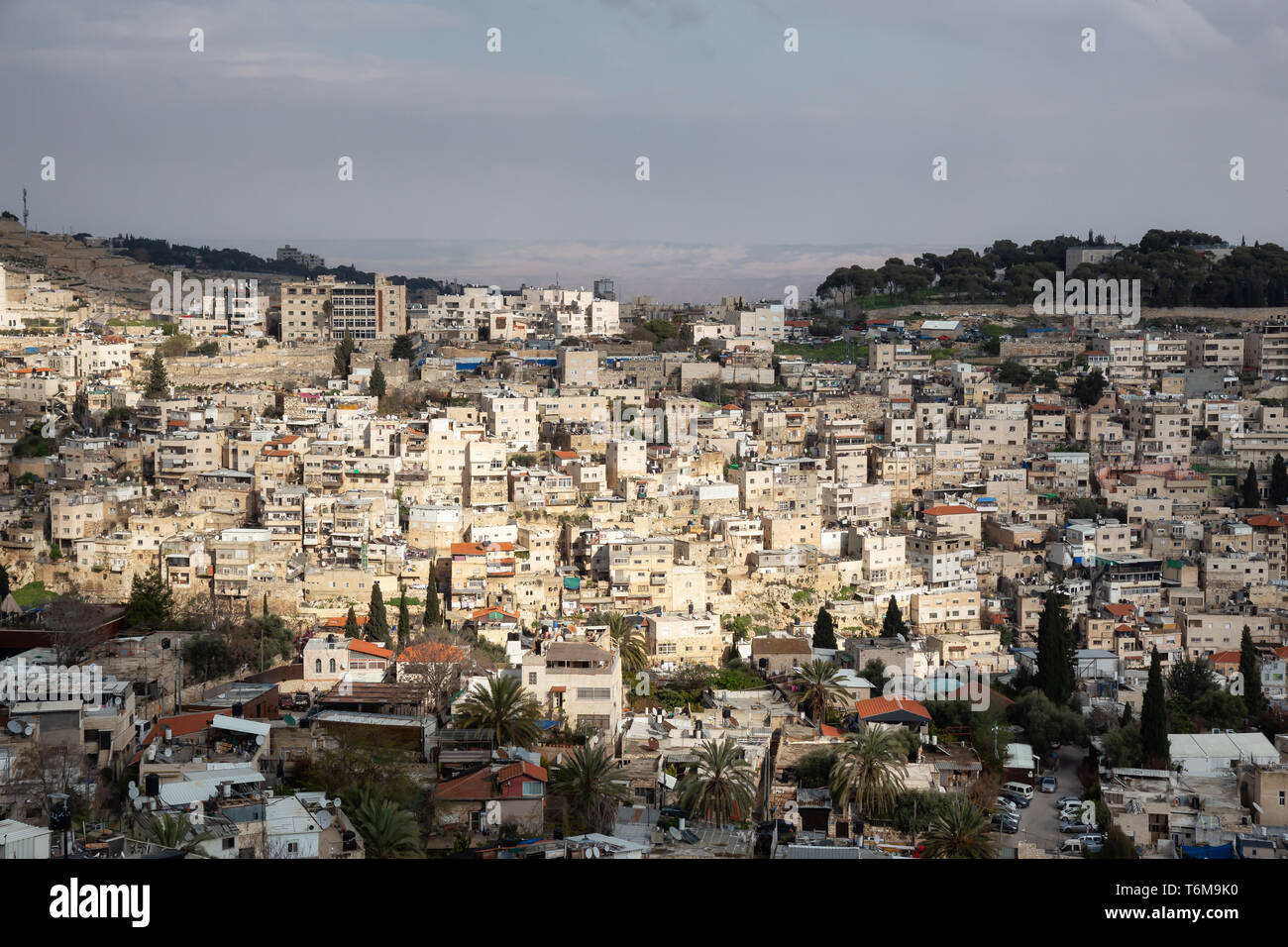 Aerial cityscape view of residential neighborhood during a cloudy day ...