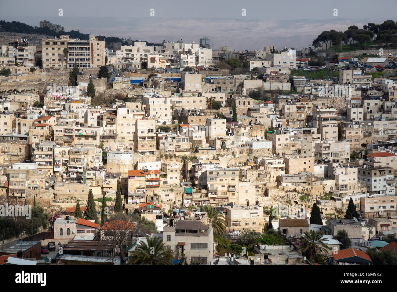 Aerial cityscape view of residential neighborhood during a cloudy day ...
