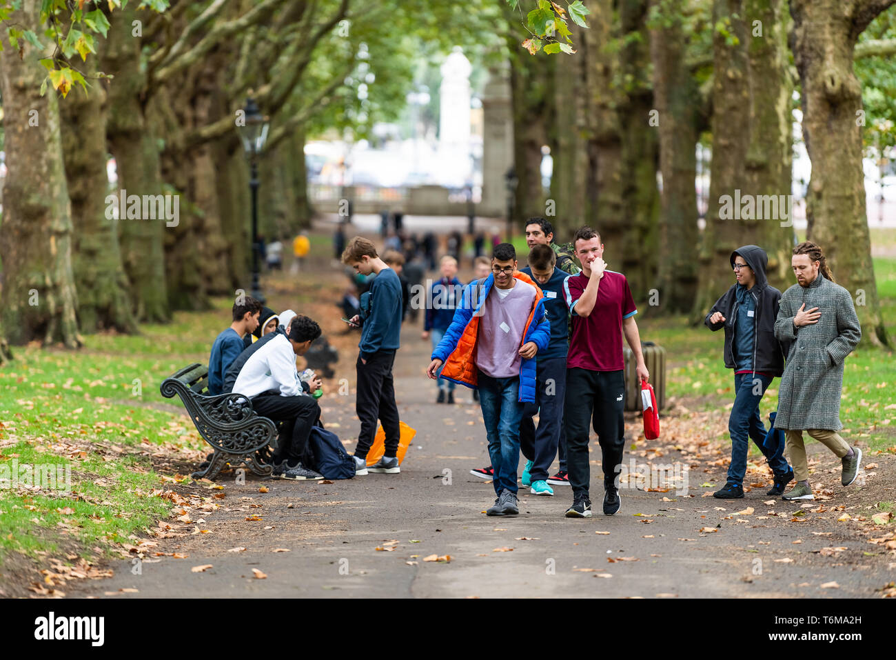 London, UK - September 12, 2018: People walking in alley path in Green ...
