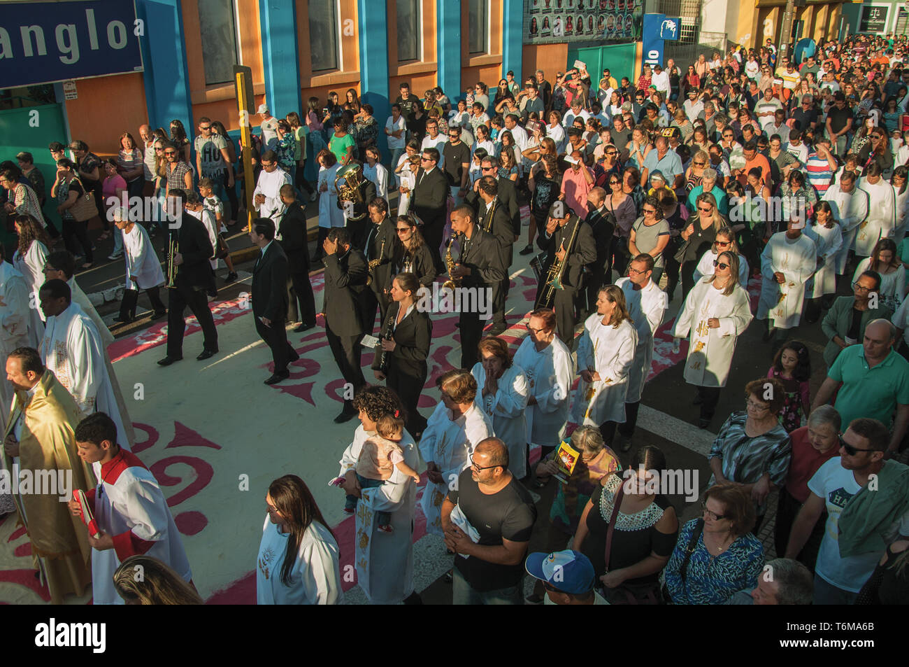 Sao Manuel, Brazil. Crowd with religious procession passing by a ...