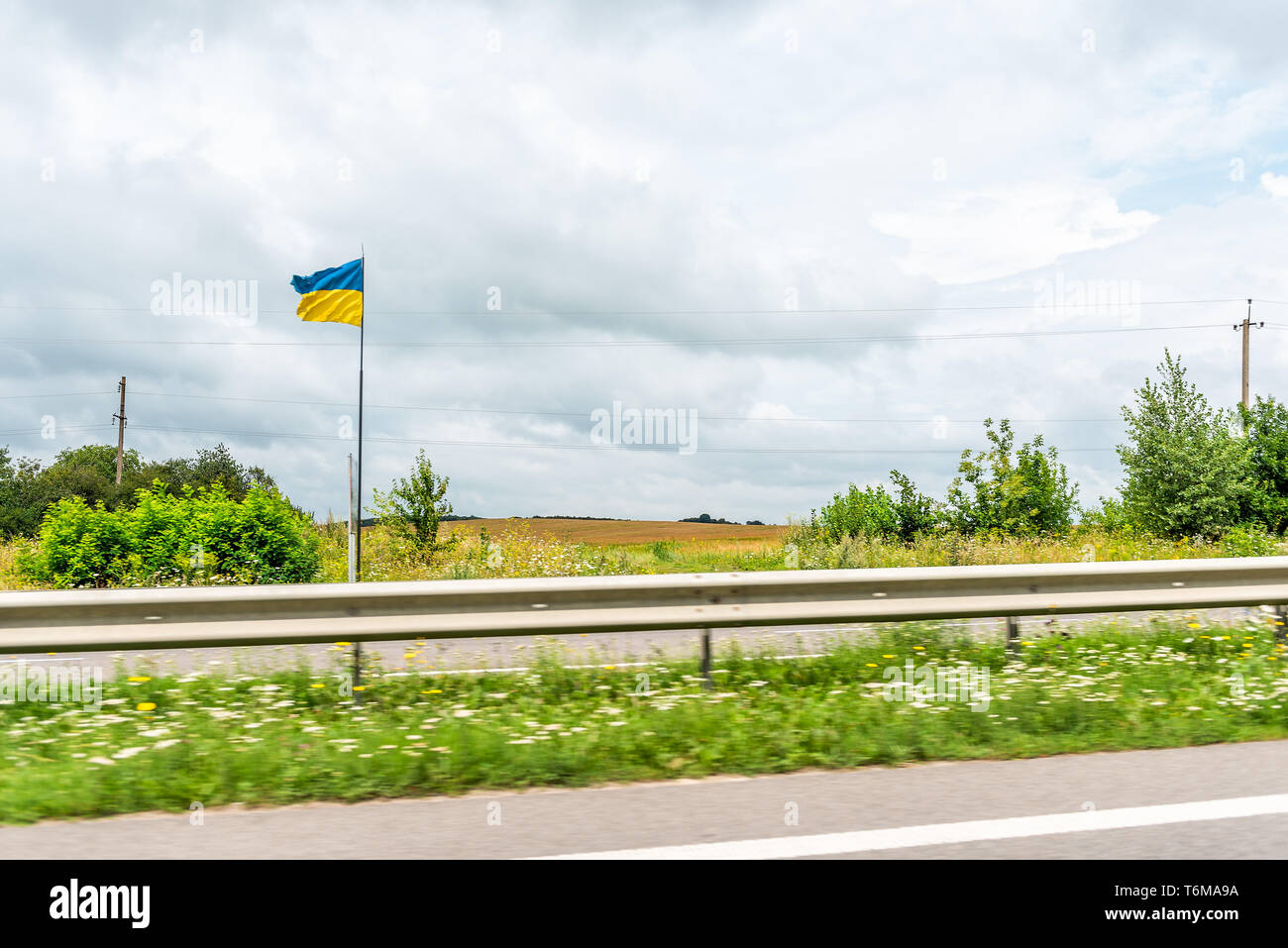 Ukrainian flag sign by road in Rivne, Ukraine Western country on ...