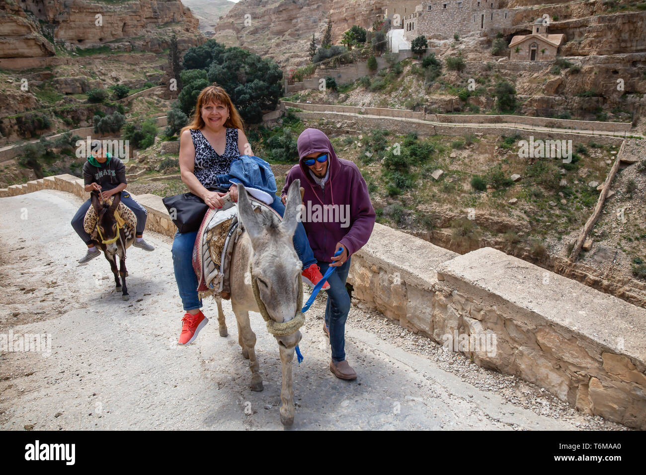 Woman riding donkey hi-res stock photography and images - Alamy