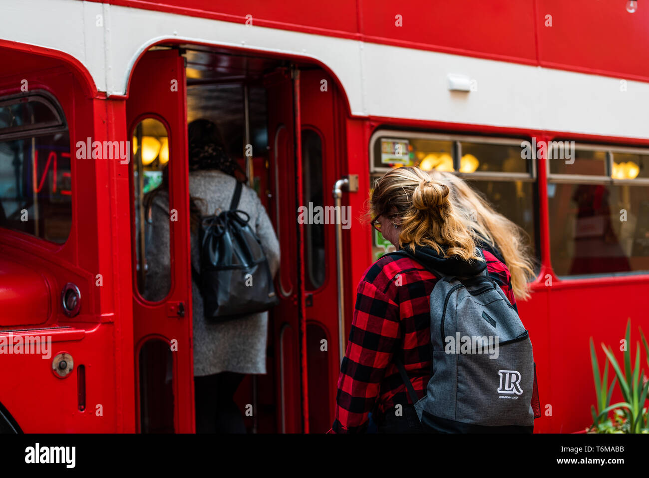 Asheville, USA - April 19, 2018: People entering bus cafe restaurant ...