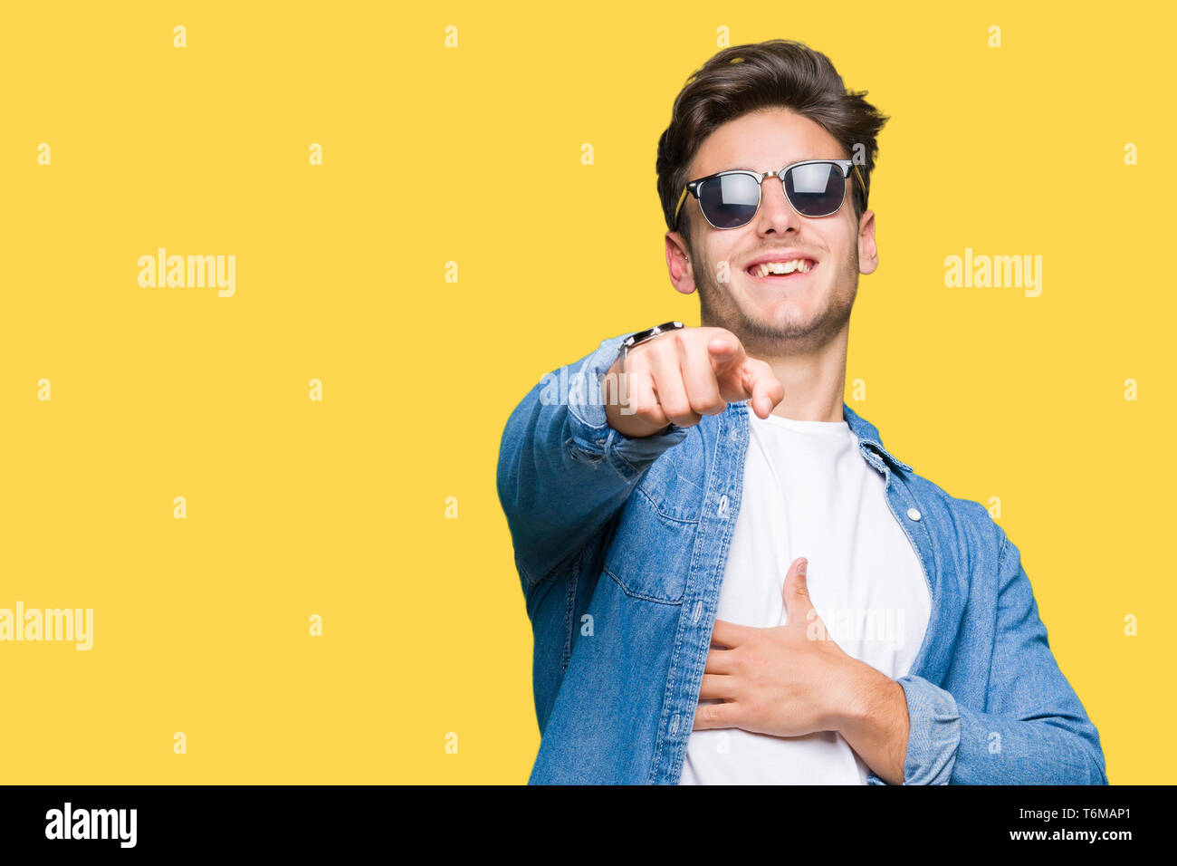 Young handsome man wearing sunglasses over isolated background Laughing ...