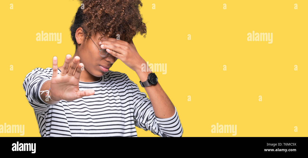 Beautiful young african american woman wearing glasses over isolated ...